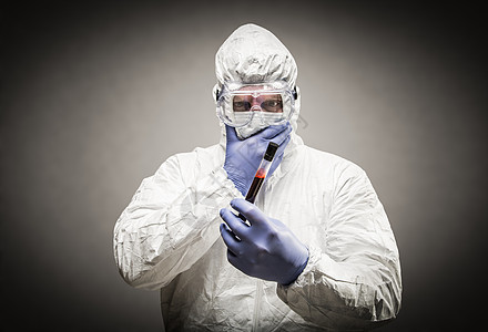 男人穿着HAZMAT防护服装持有测试管充满高清图片下载-正版图片503474020-摄图网