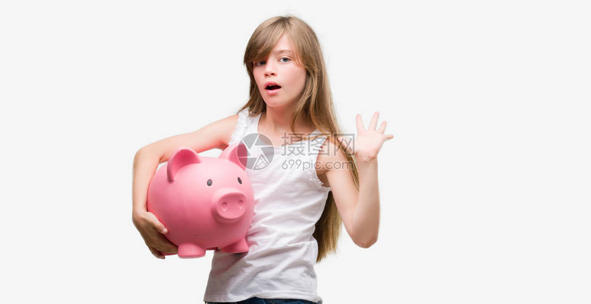 年轻的金发幼儿拿着存钱罐非常高兴和奋高清图片下载 正版图片502539330 摄图网