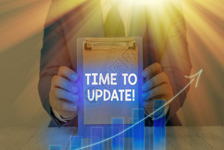 显示更新时间的概念手写概念意味着这是制造更现代的新事物的正确时机两只手持电子设备几何图片素材-正版创意图片504048046-摄图网