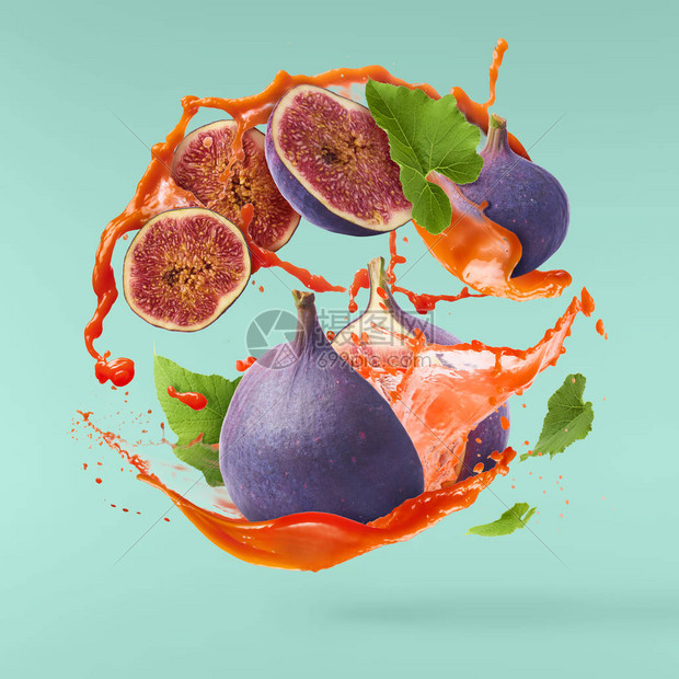 在空气中飞行新鲜的成熟整体并切开Figs与果汁喷洒分离在糊涂绿宝石背景高清图片下载-正版图片505973910-摄图网